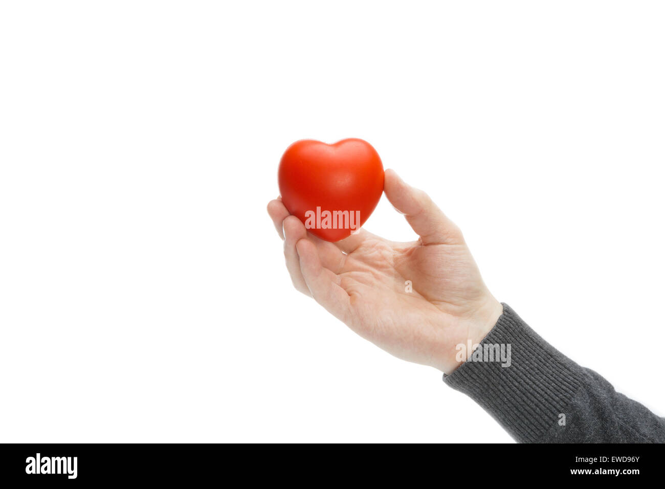 Male holding heart shaped toy in hand Stock Photo - Alamy