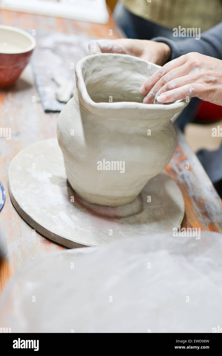 Close up of a woman making pottery Stock Photo - Alamy