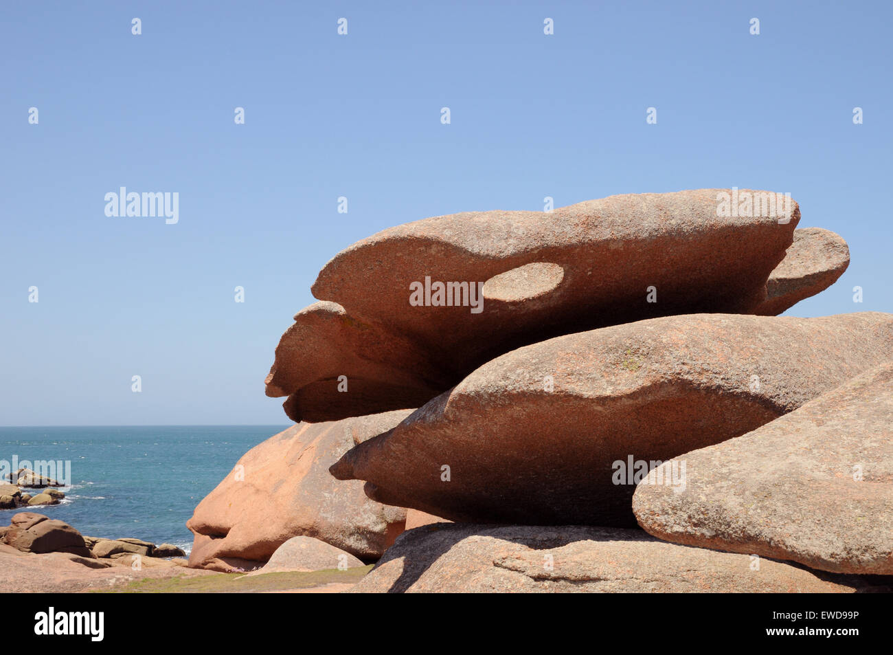 Boulders and rock formations on the Granit Rose (pink granite) coast of ...