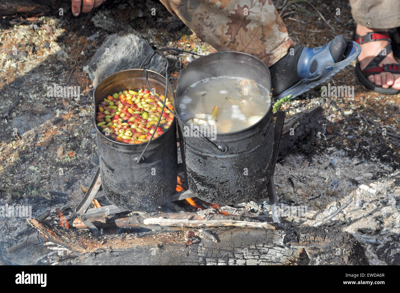 Cooking on a fire. Cooking in field conditions spur the imagination of ...