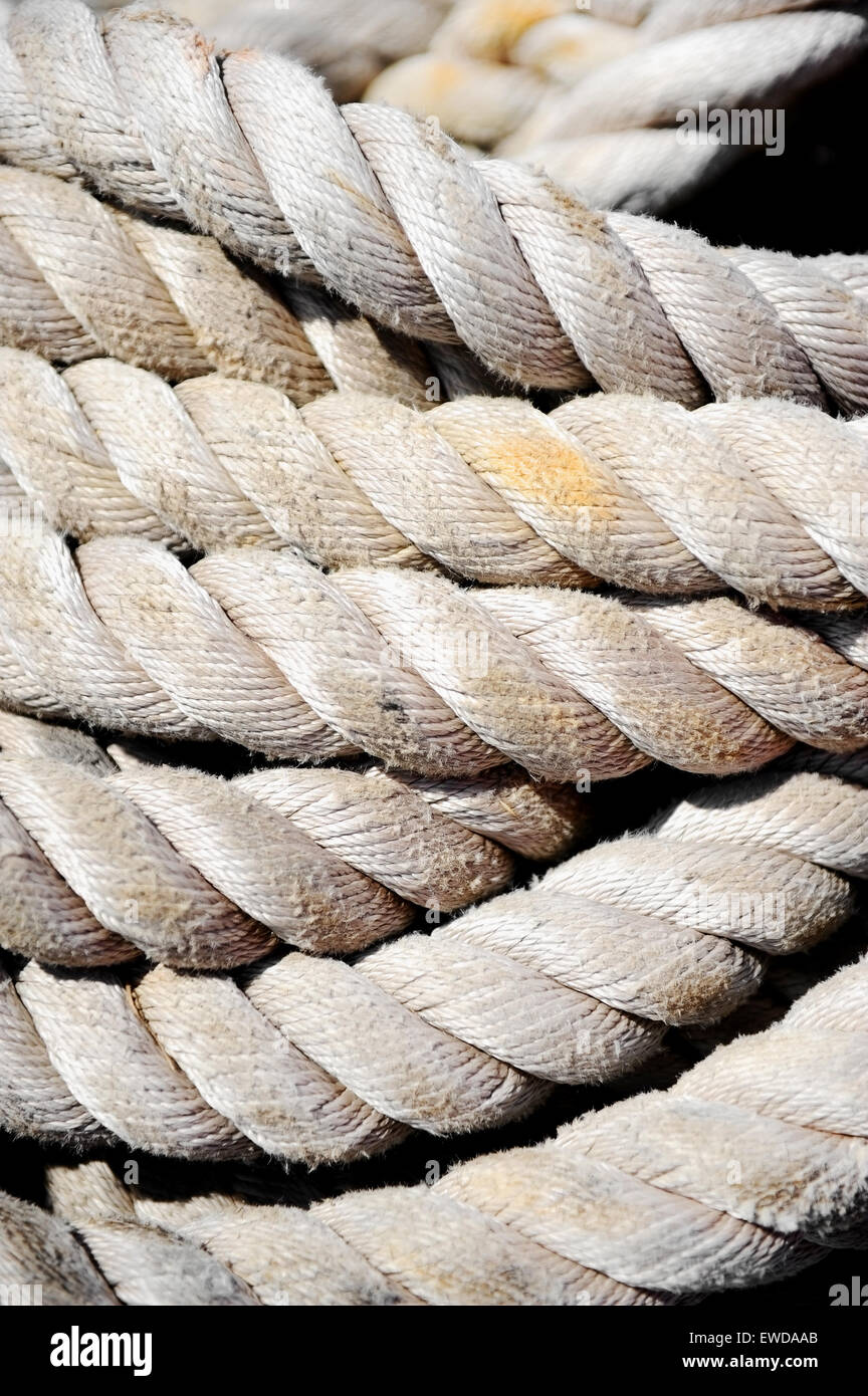 Industrial detail with a heap of old maritime sea ropes Stock Photo - Alamy