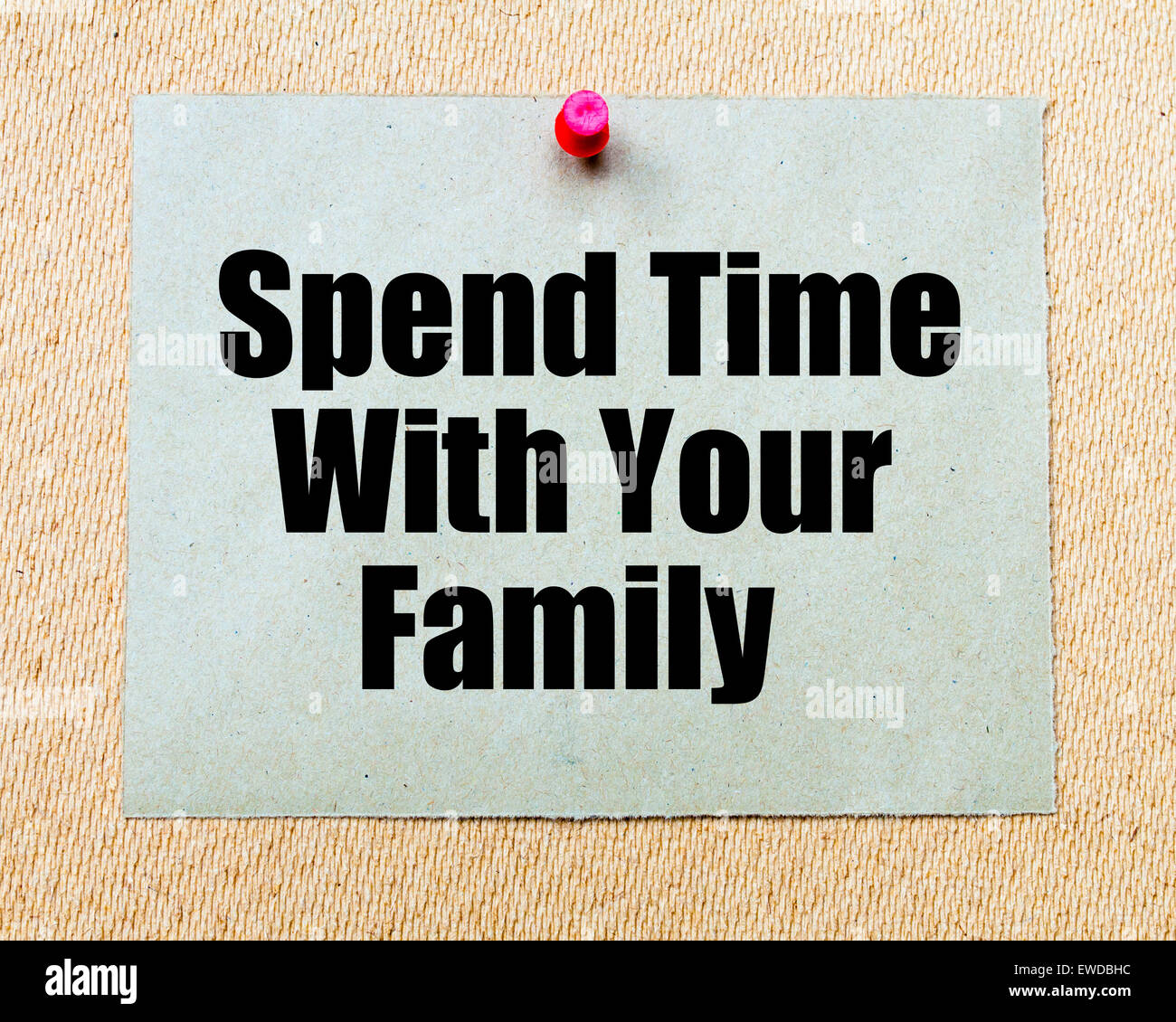 Spend Time With Your Family written on paper note pinned with red ...