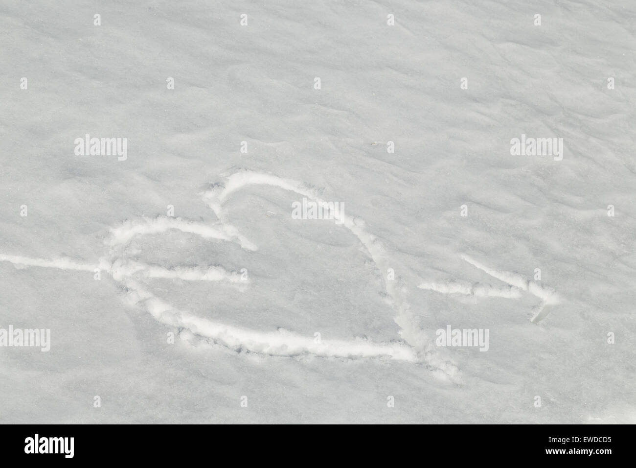Drawing heart arrow in snow hi-res stock photography and images - Alamy