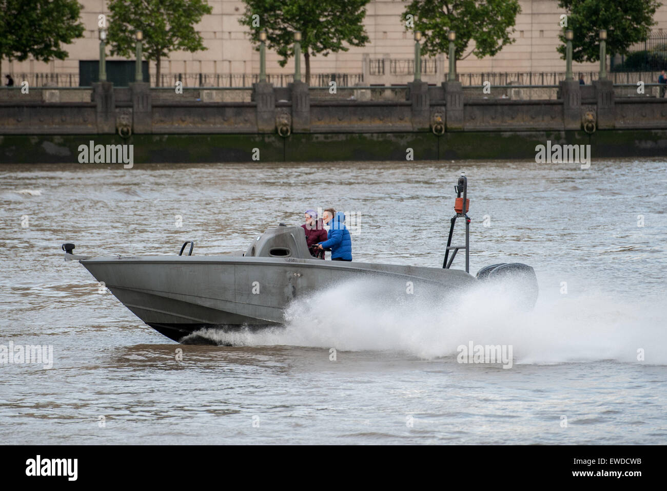 London, UK. 22 June, 2015. A military style boat in front of the MI6 ...