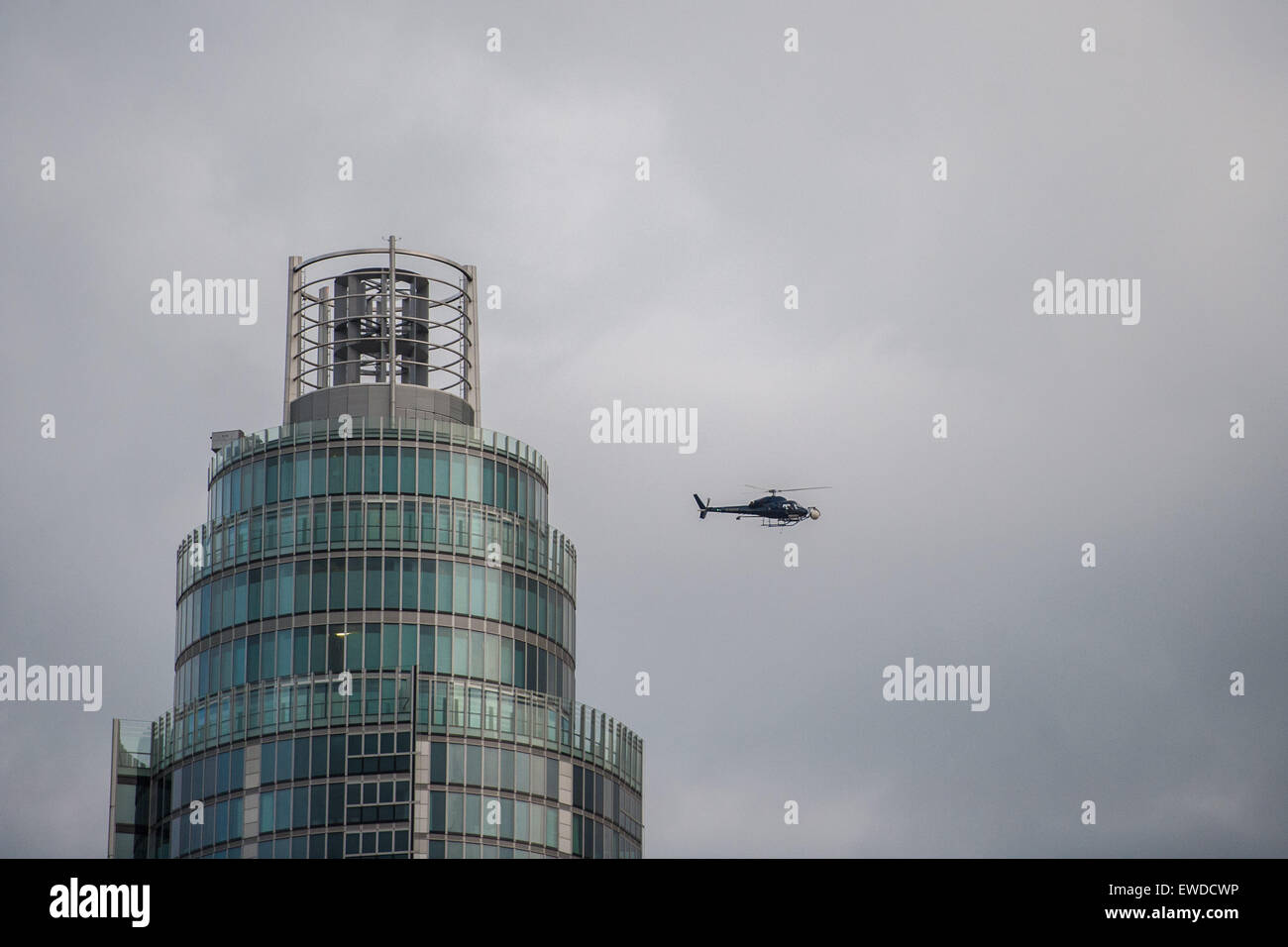 London, UK. 22 June, 2015. A helicopter flies over the MI6 building ...