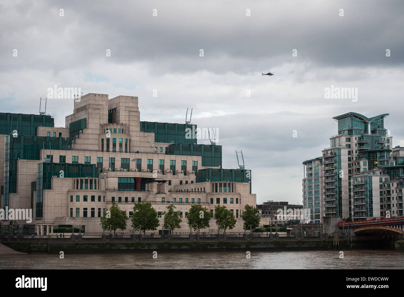 London, UK. 22 June, 2015. A helicopter flies over the MI6 building ...