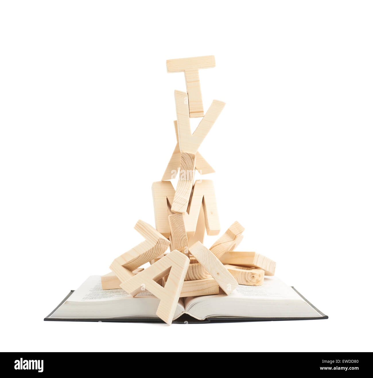 Pile of wooden letters over the book Stock Photo - Alamy