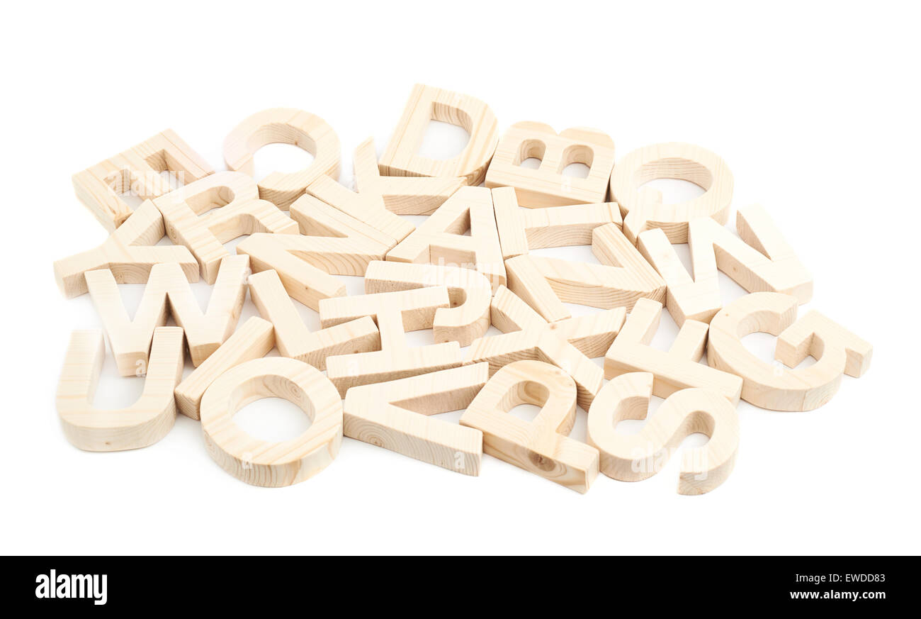 Pile of wooden block letters isolated Stock Photo - Alamy