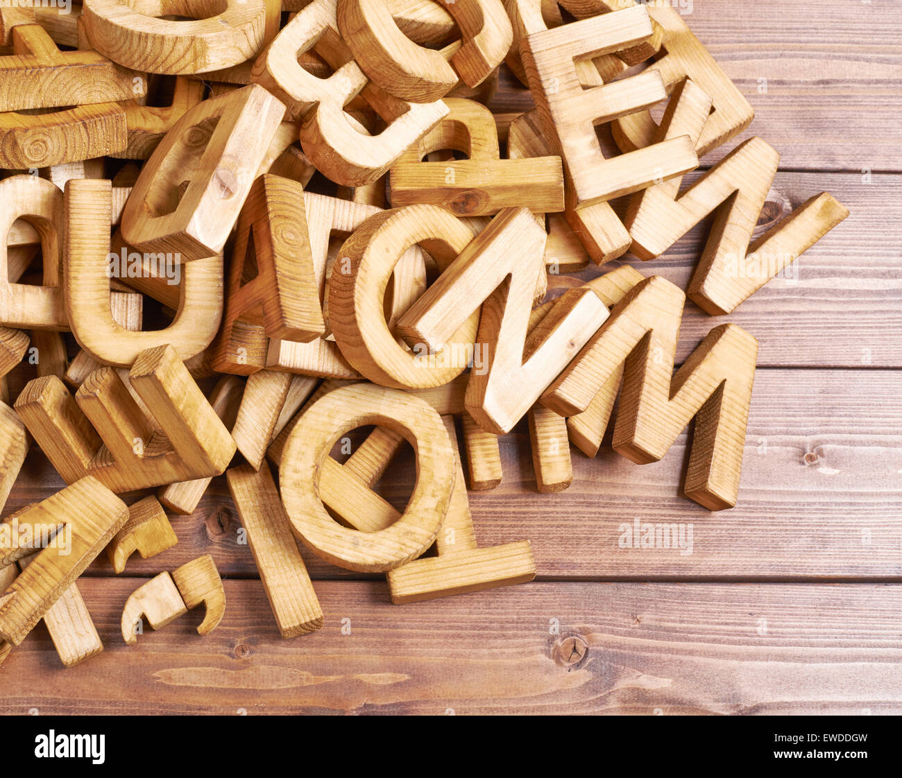 Pile of wooden letters over the wooden surface Stock Photo - Alamy
