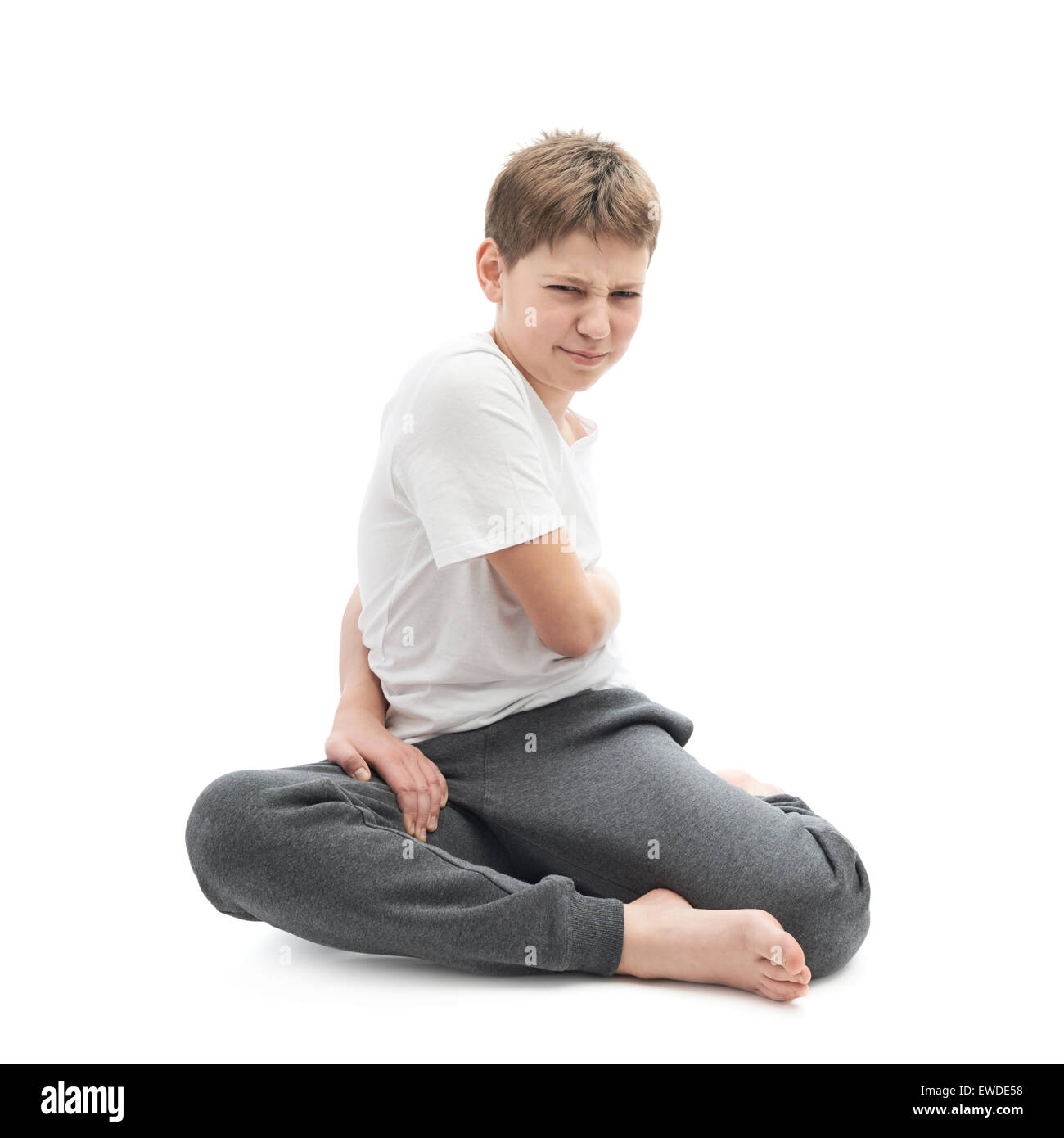Young boy stretching or doing yoga Stock Photo - Alamy