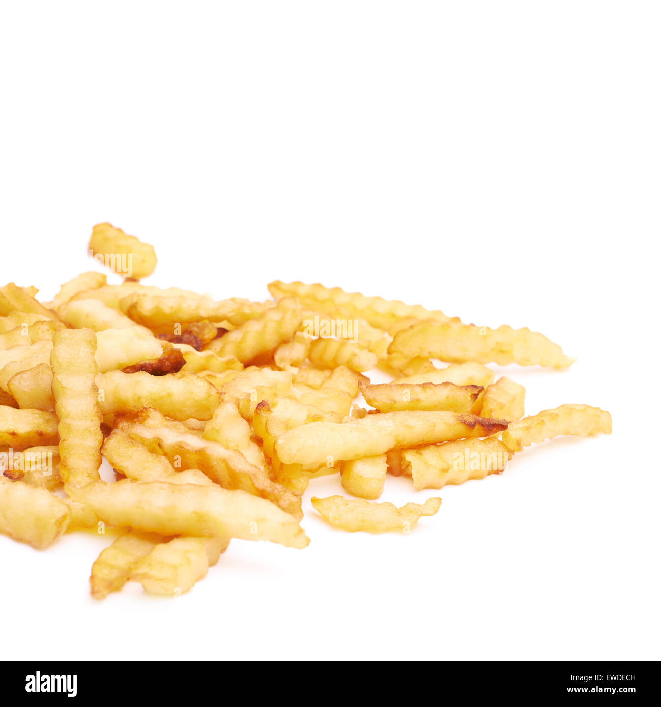 Pile of multiple wavy french fries isolated Stock Photo - Alamy
