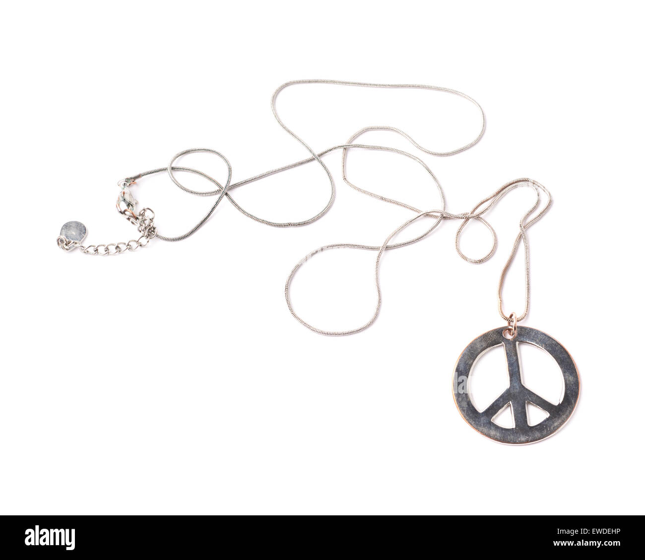 Worn metal peace sign necklace isolated Stock Photo - Alamy