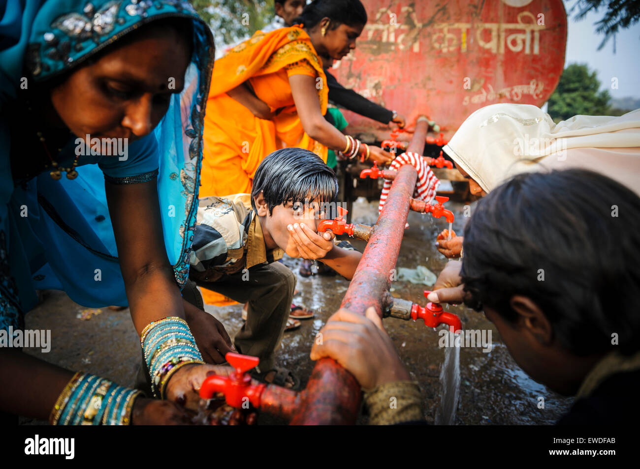 People drinking water during a festival in Uttar Pradesh, India Stock ...