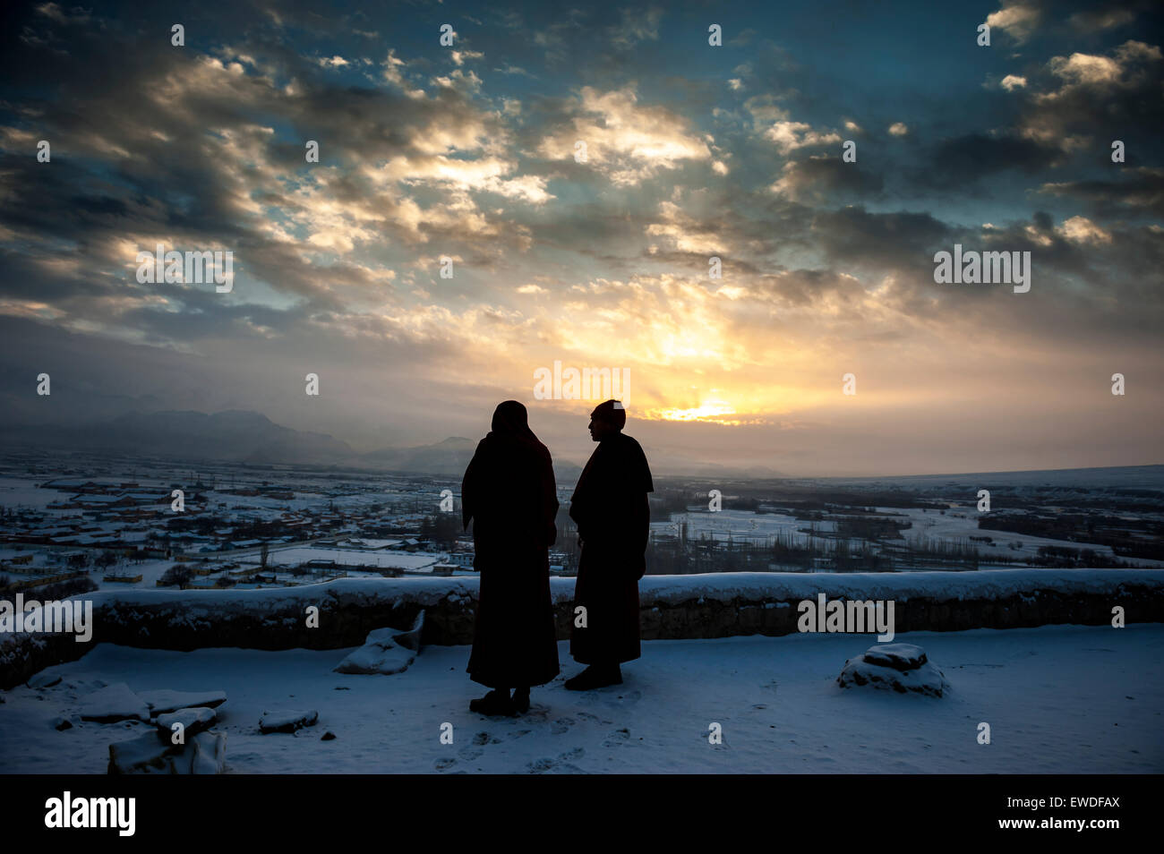 Two monks standing on a roof of Spitok Monastery, Ladakh, India Stock ...