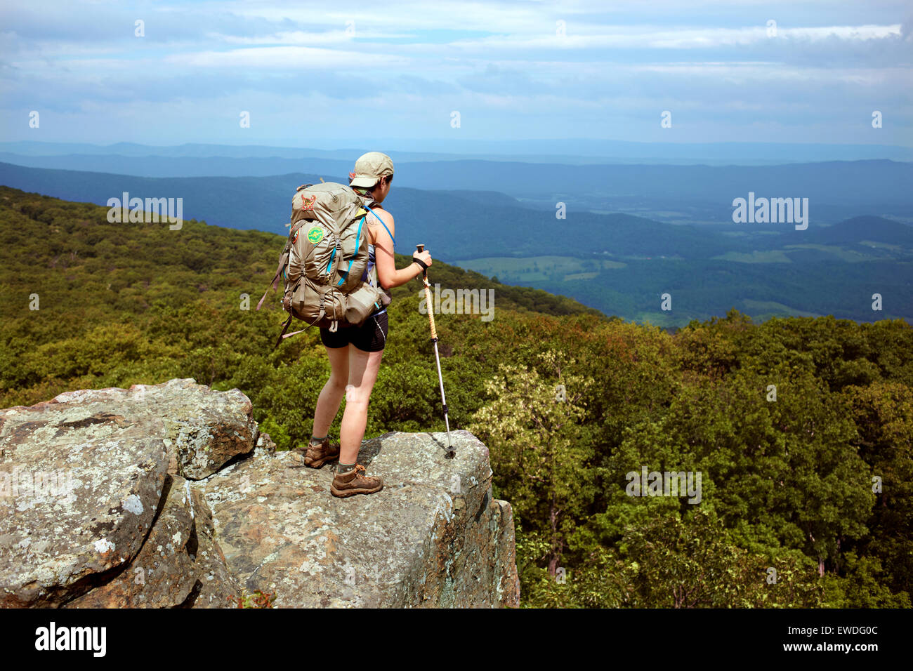 A hiker looking over a Valley Stock Photo - Alamy