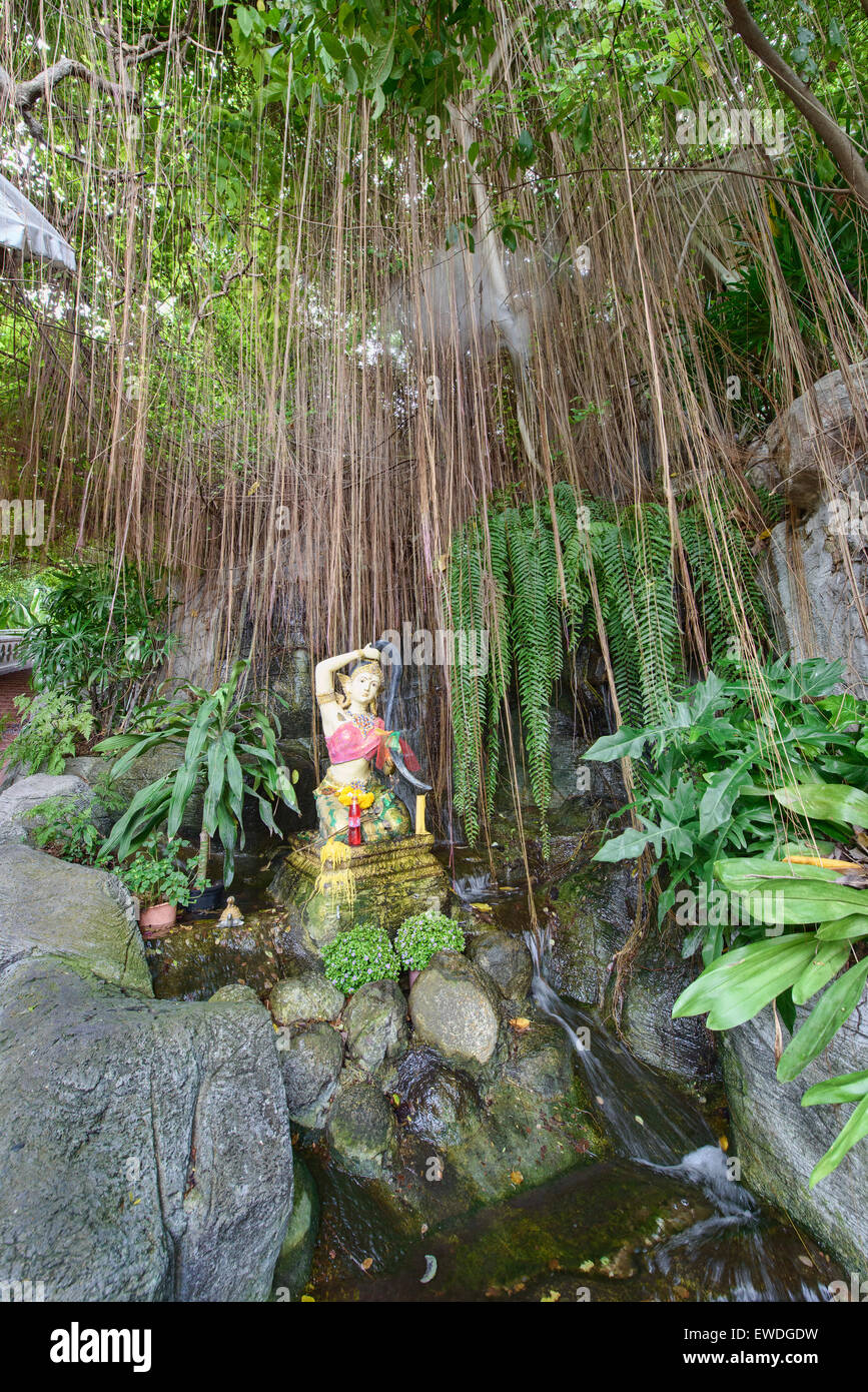 Hanging tree vines mark the entrance to Wat Saket (The Golden Mount) in ...