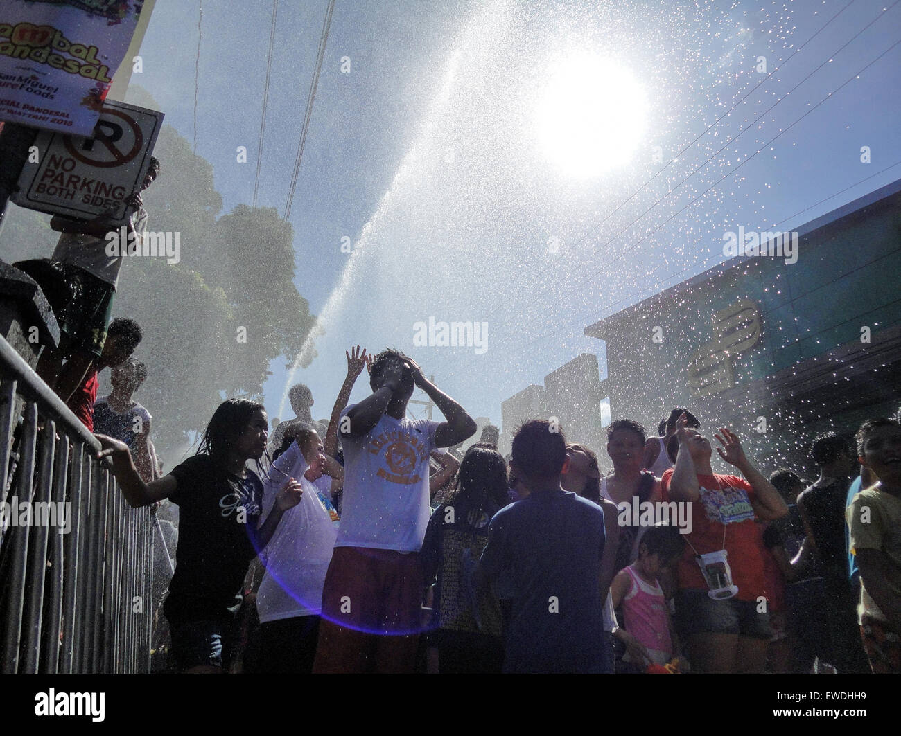 San Juan City, Phillipines. 24th June, 2015. A fireman sprays water ...