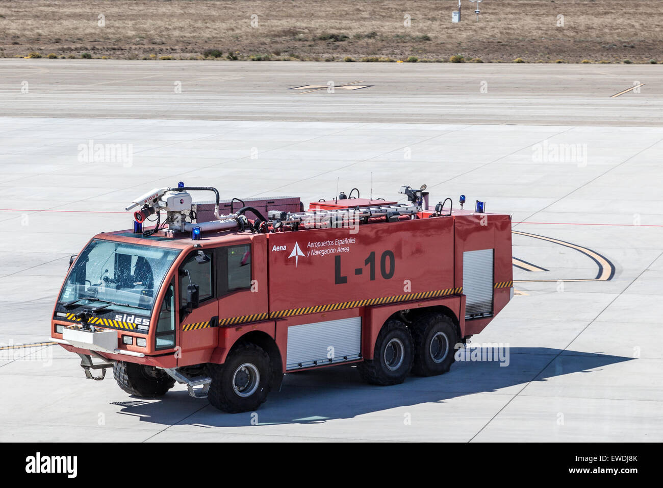 Fire truck on the runway of the airport in Zaragoza, Spain Stock Photo ...