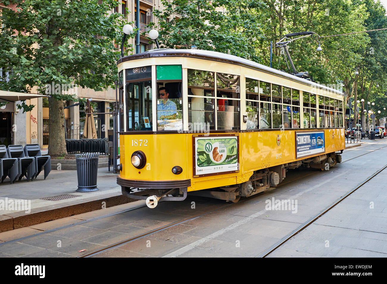Old vintage Milan Orange Cable Car and his driver on the street of ...