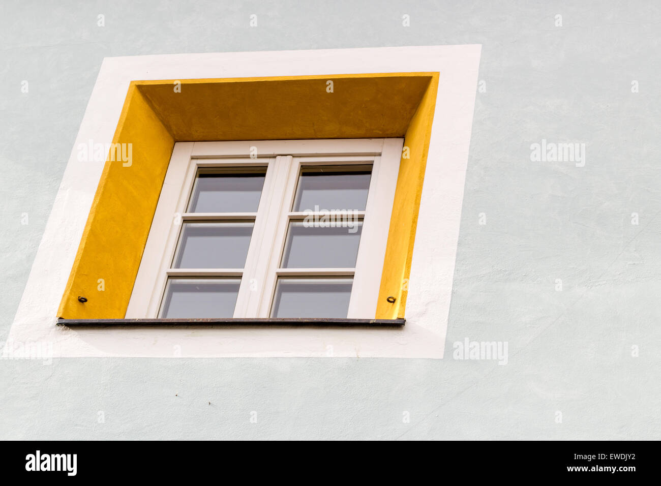 Squared glass window with white frame and simple yellow border Stock ...