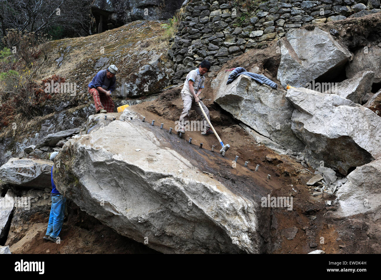 Nepalese men breaking rocks for building materials, Namche Bazar ...