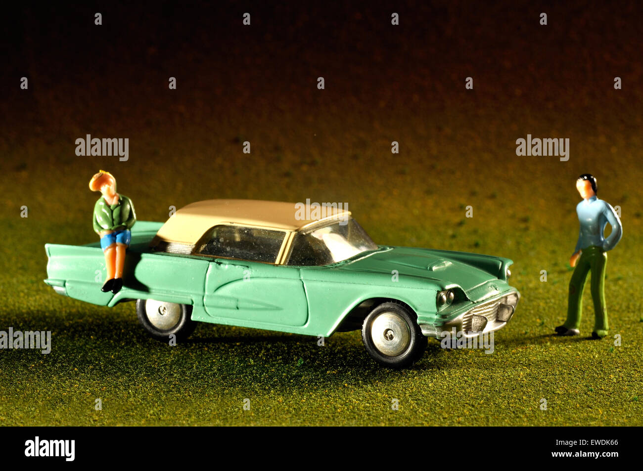 Model Ford Thunderbird with miniature people car in studio setting ...