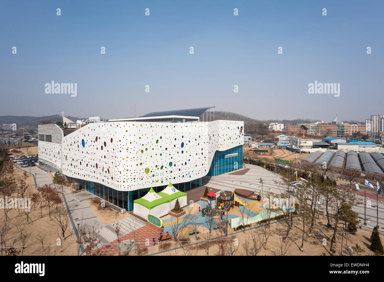 General exterior morning view with urban context. Incheon Children ...