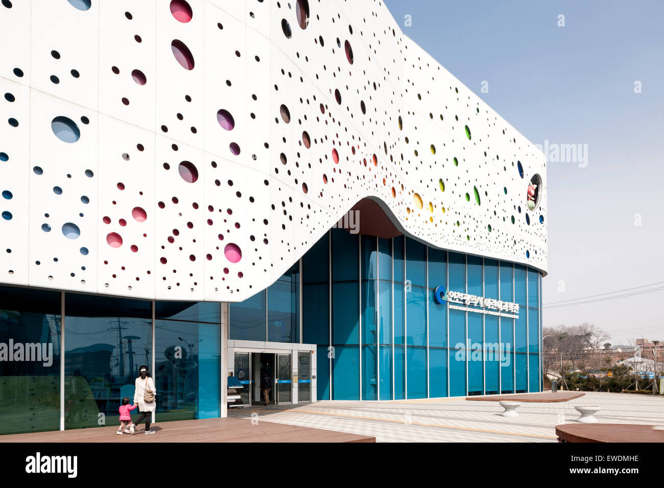 A woman with her child walking by the entrance. Incheon Children ...