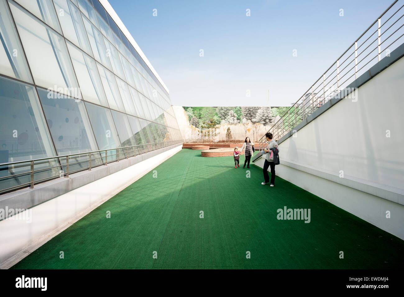 A couple and their child leaving the roof terrace. Incheon Children ...