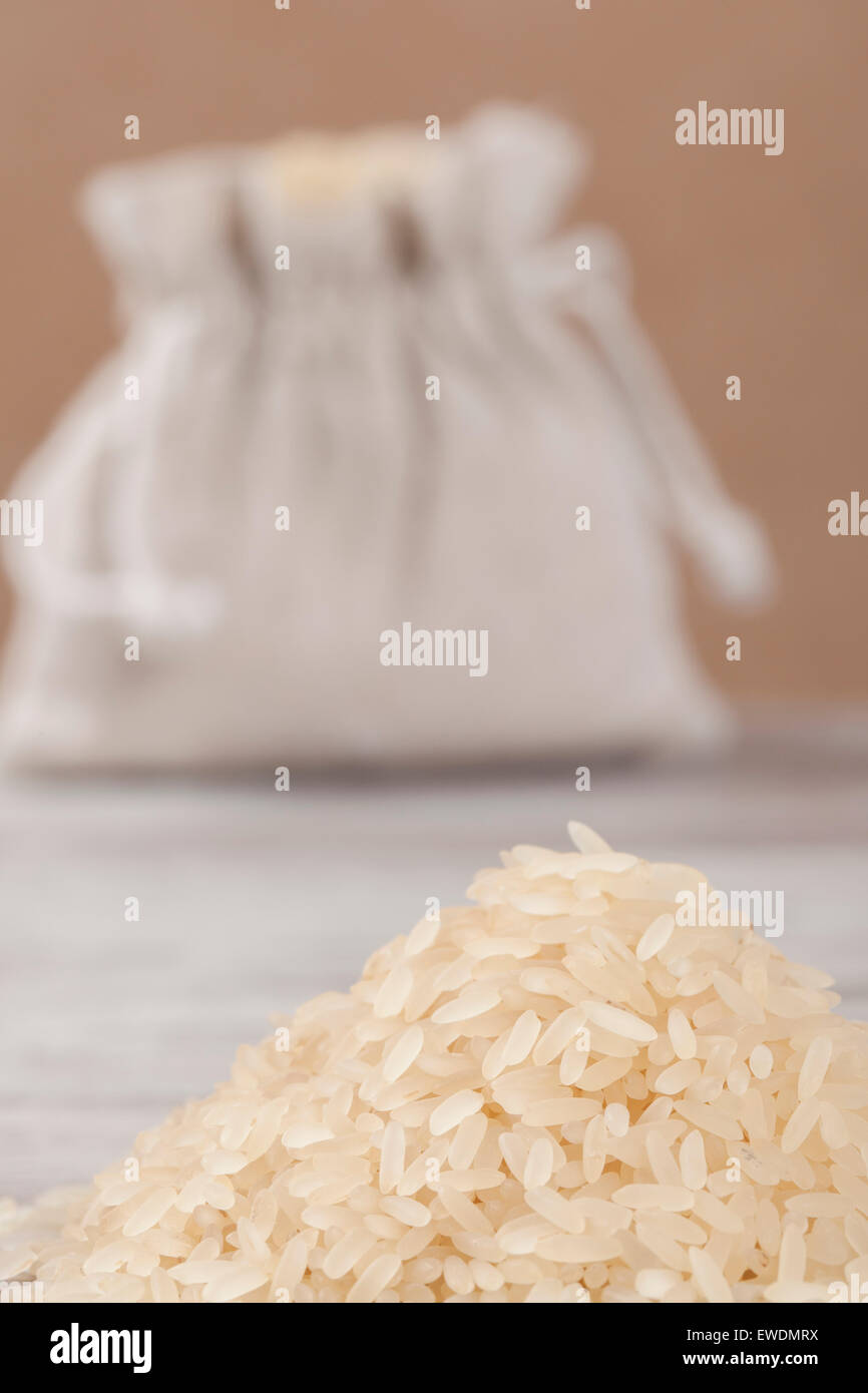burlap sack full of rice Stock Photo - Alamy