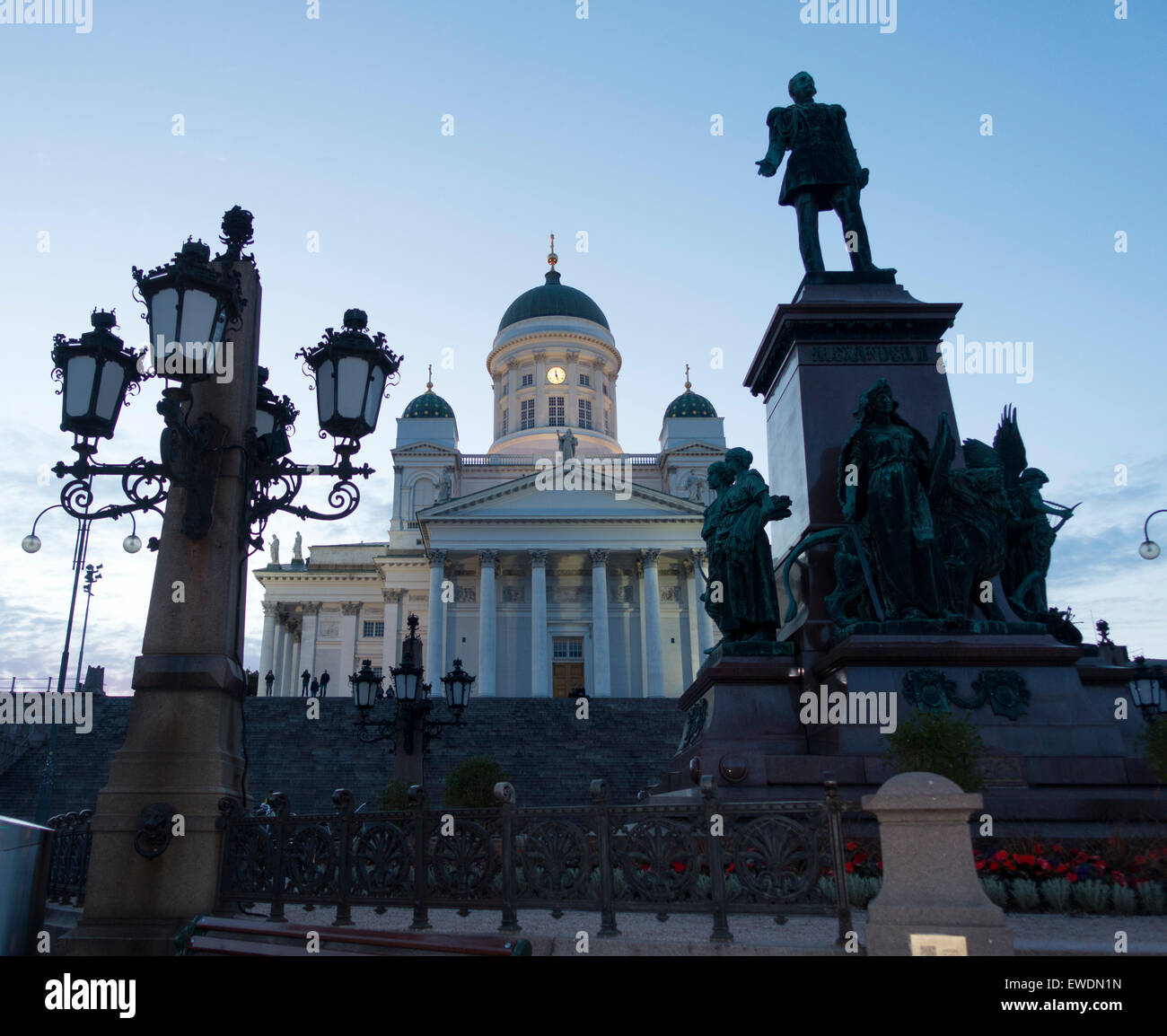 Helsinki Cathedral at sunset. Statue and lamps in foreground Stock ...