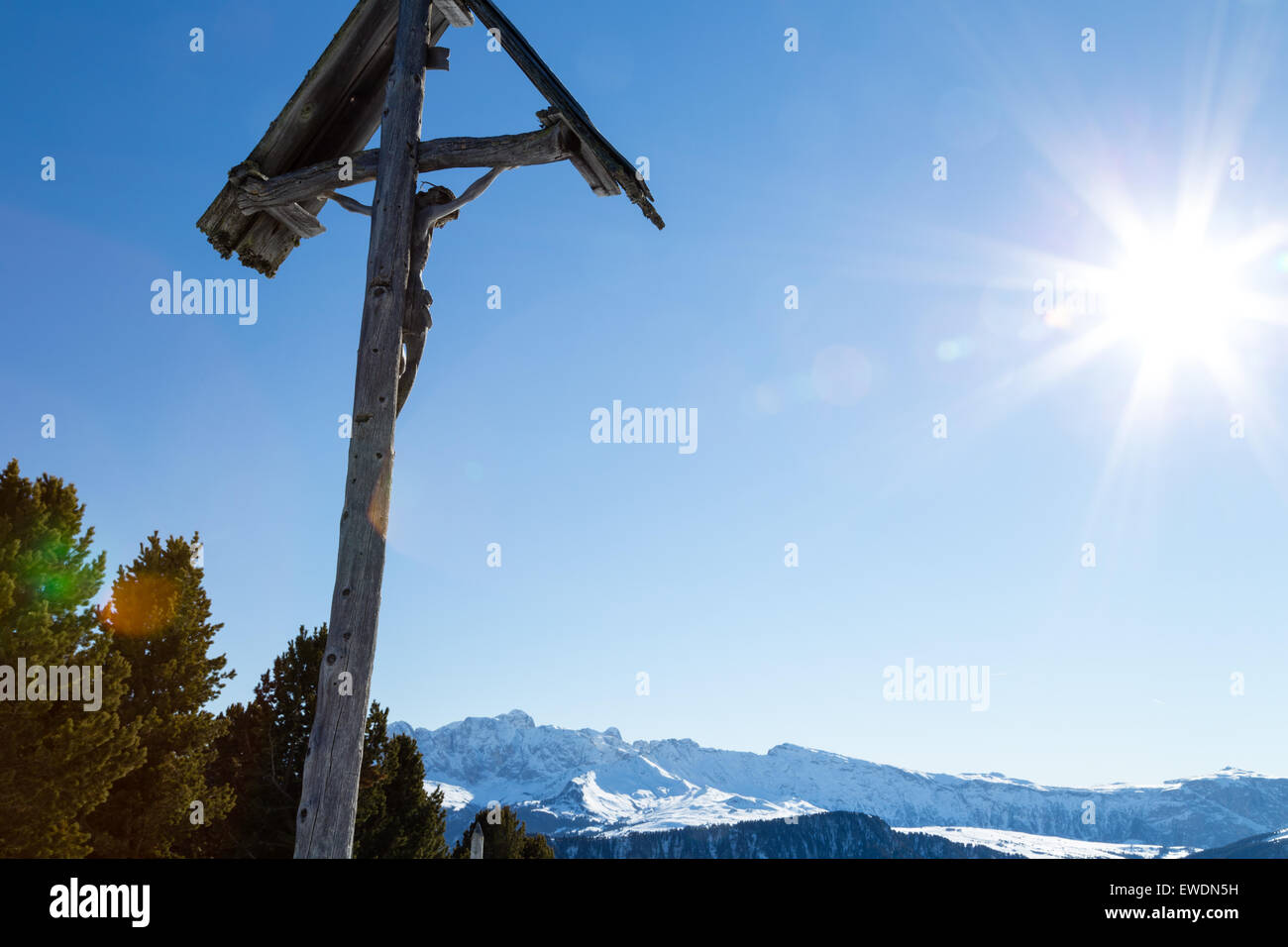 A wood carved statue of the Crucifixion of Jesus Christ on top of the ...