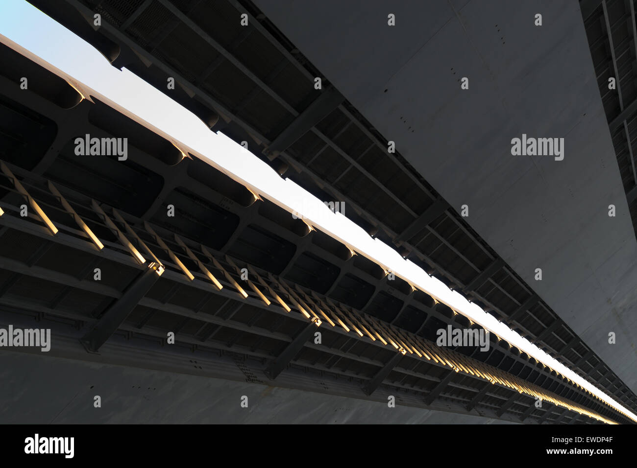 Underneath view and detail of a metal road bridge and sunlight Stock ...