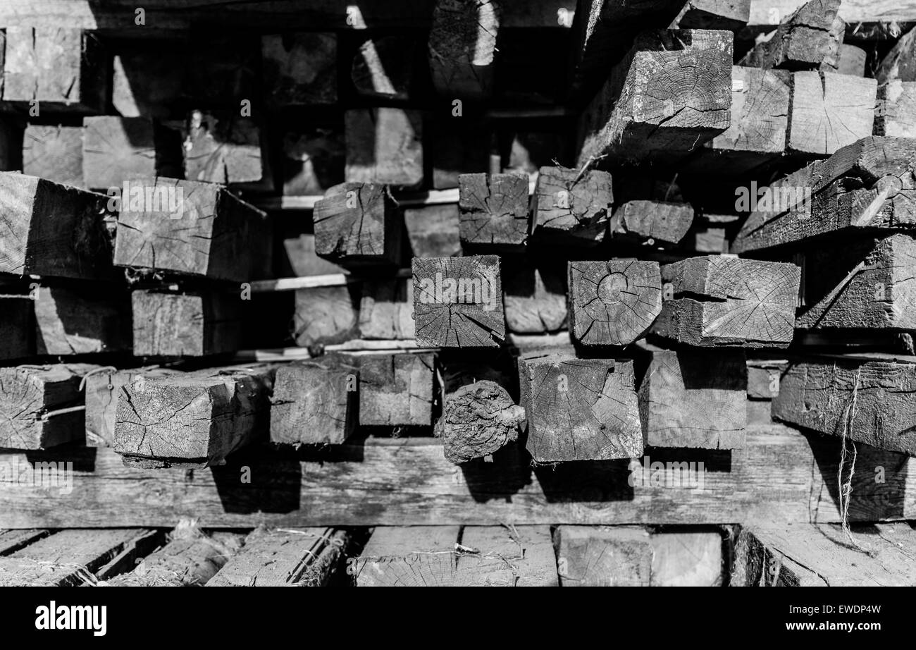 Piled up construction lumber in black and white with shadows Stock ...