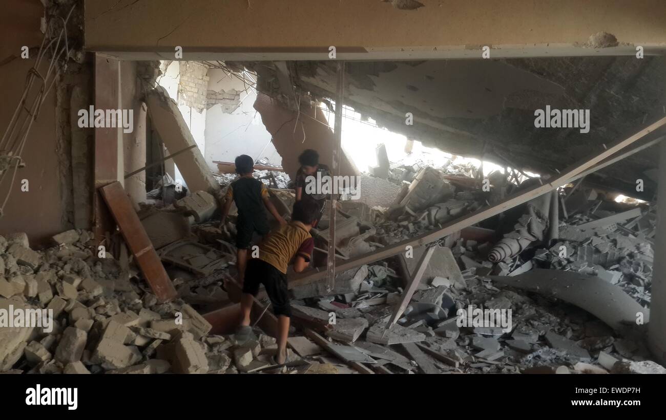 Fallujah, Iraq. 24th June, 2015. Three boys play inside a destroyed ...