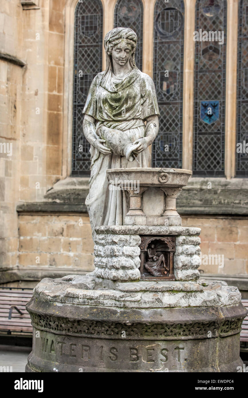 Statue of a woman with a jug next to a fountain by Bath Abbey in Bath ...