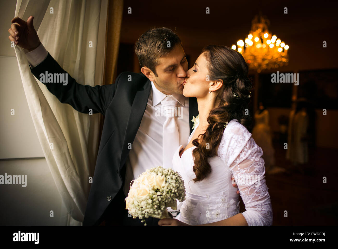 Gorgeous wedding couple kissing Stock Photo - Alamy