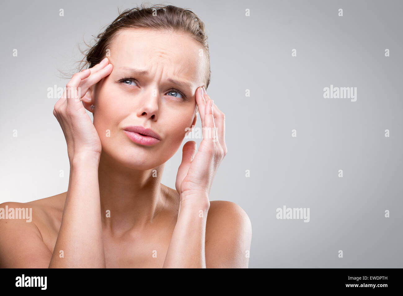 Gorgeous young woman with severe headache/migraine (color toned image ...