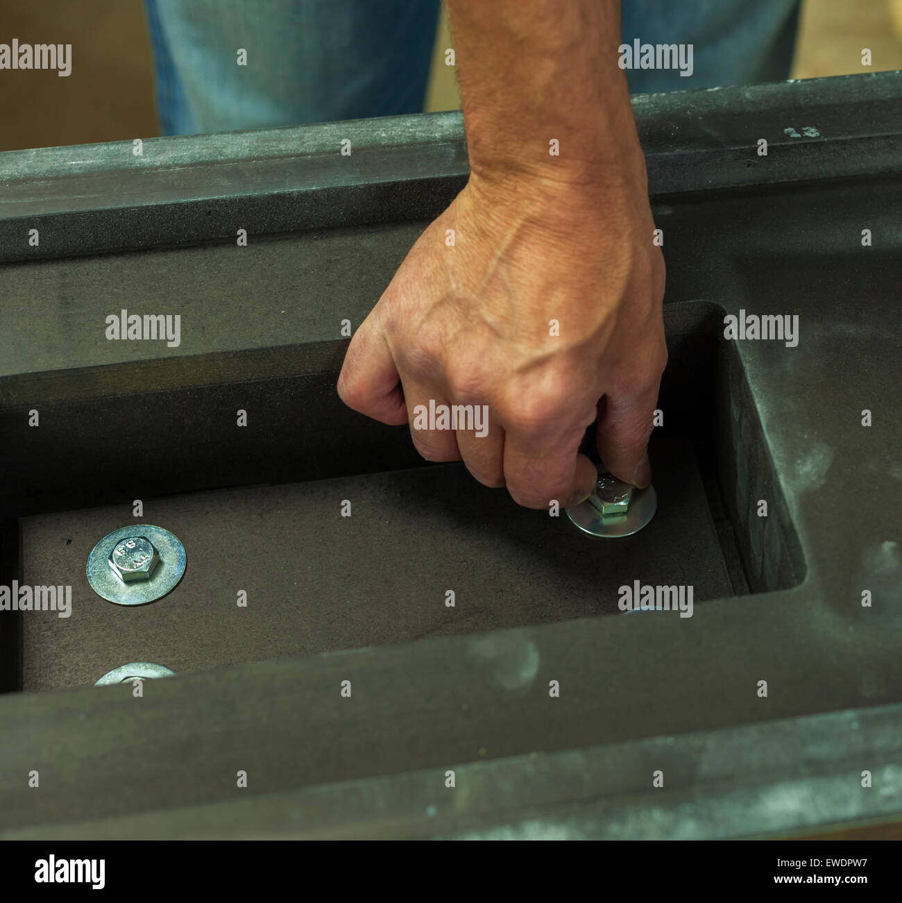 Image of Hand of a Man Inserting Bolt in to Piece of Furniture Stock ...