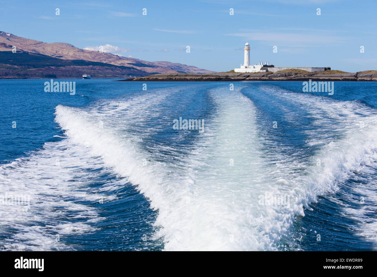 Lismore lighthouse with Calmac ferry in the distance on Sound of Mull ...