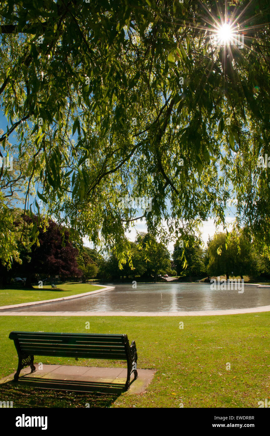 Beautiful tree-lined clean Tettenhall paddling pool on a bright sunny ...