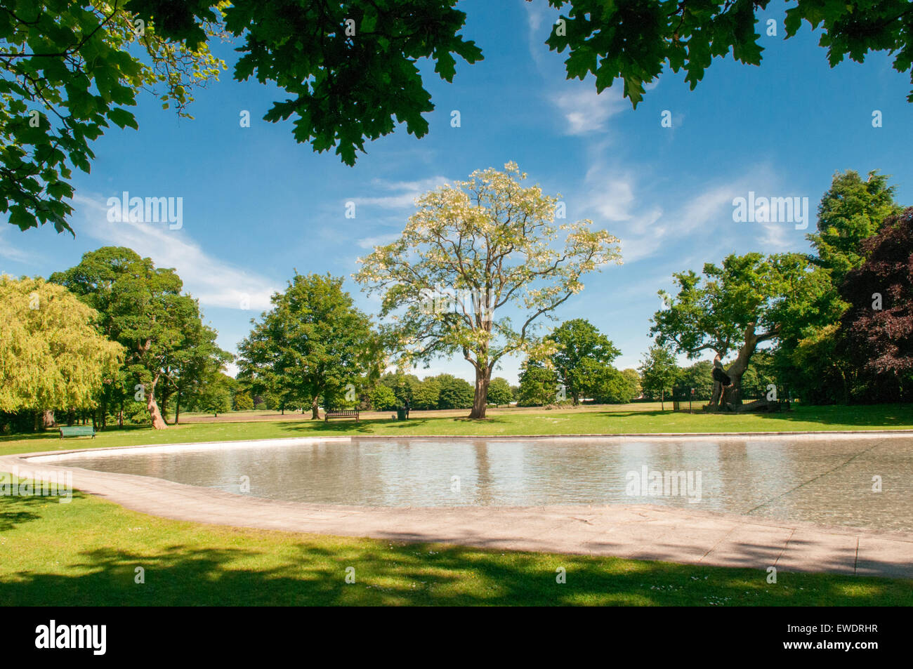 Beautiful tree-lined clean Tettenhall paddling pool on a bright sunny ...