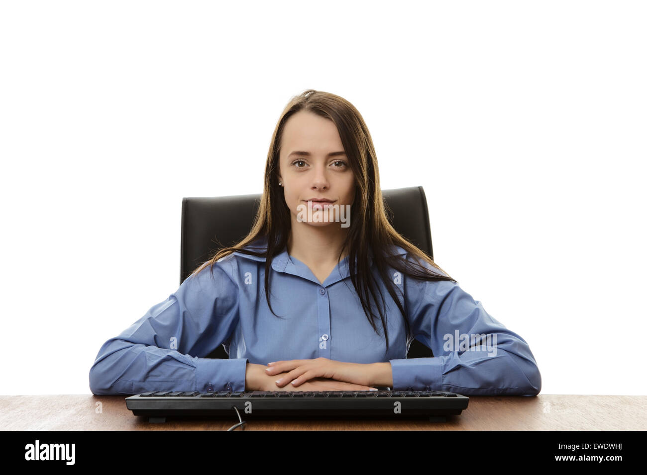 attractive business woman sitting at her desk at work Stock Photo - Alamy
