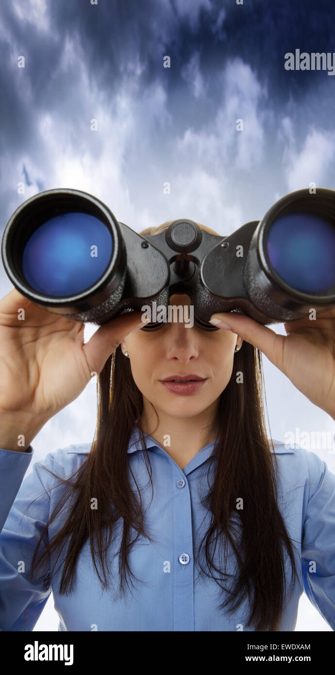 attractive business woman looking through binoculars Stock Photo - Alamy