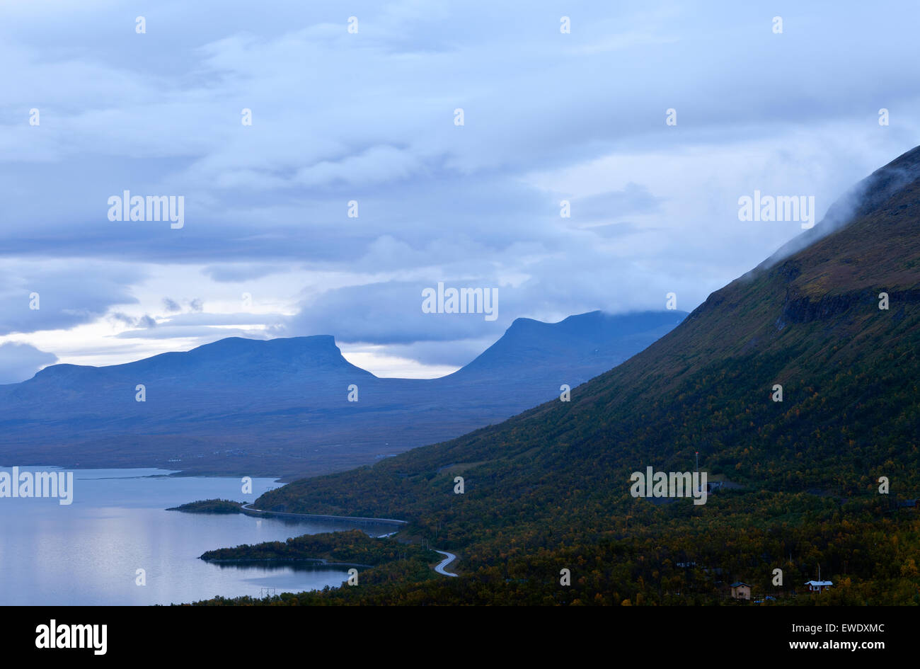 Morning view of mountains and lake in distance. Highway by the lakeside ...