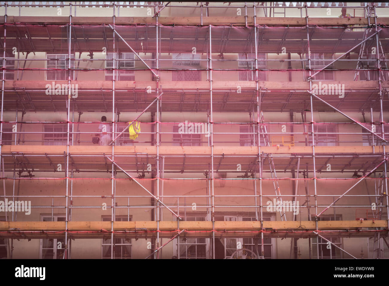 building exterior with scaffolding and netting Stock Photo - Alamy