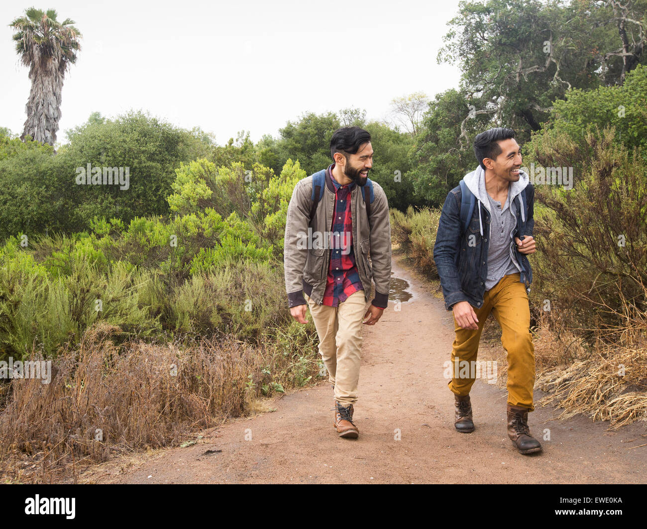 Two young men walking hi-res stock photography and images - Alamy