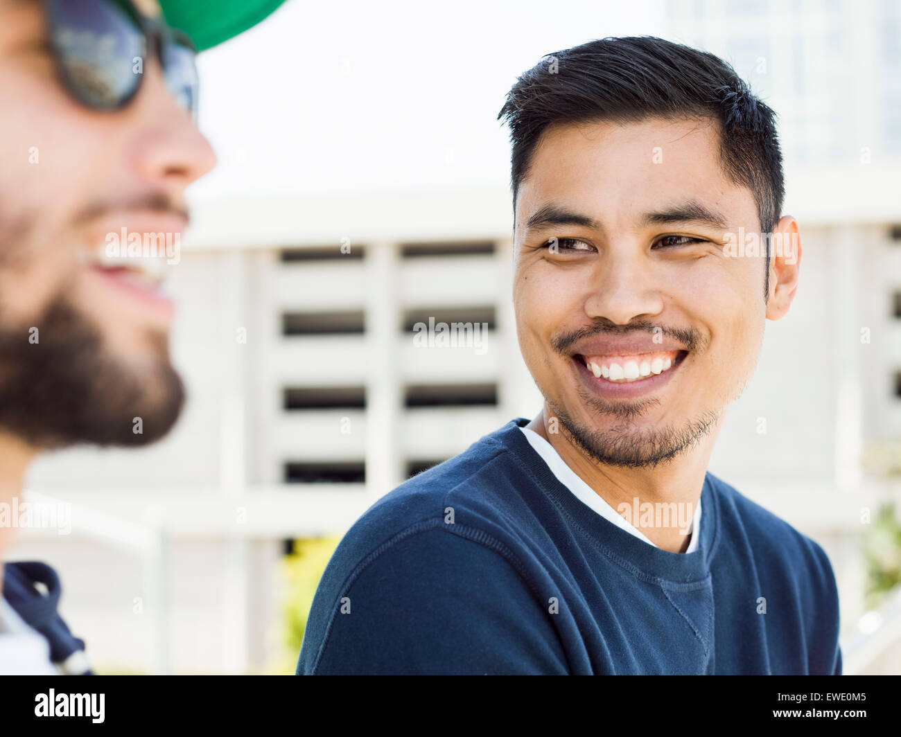 Two standing young men hi-res stock photography and images - Alamy