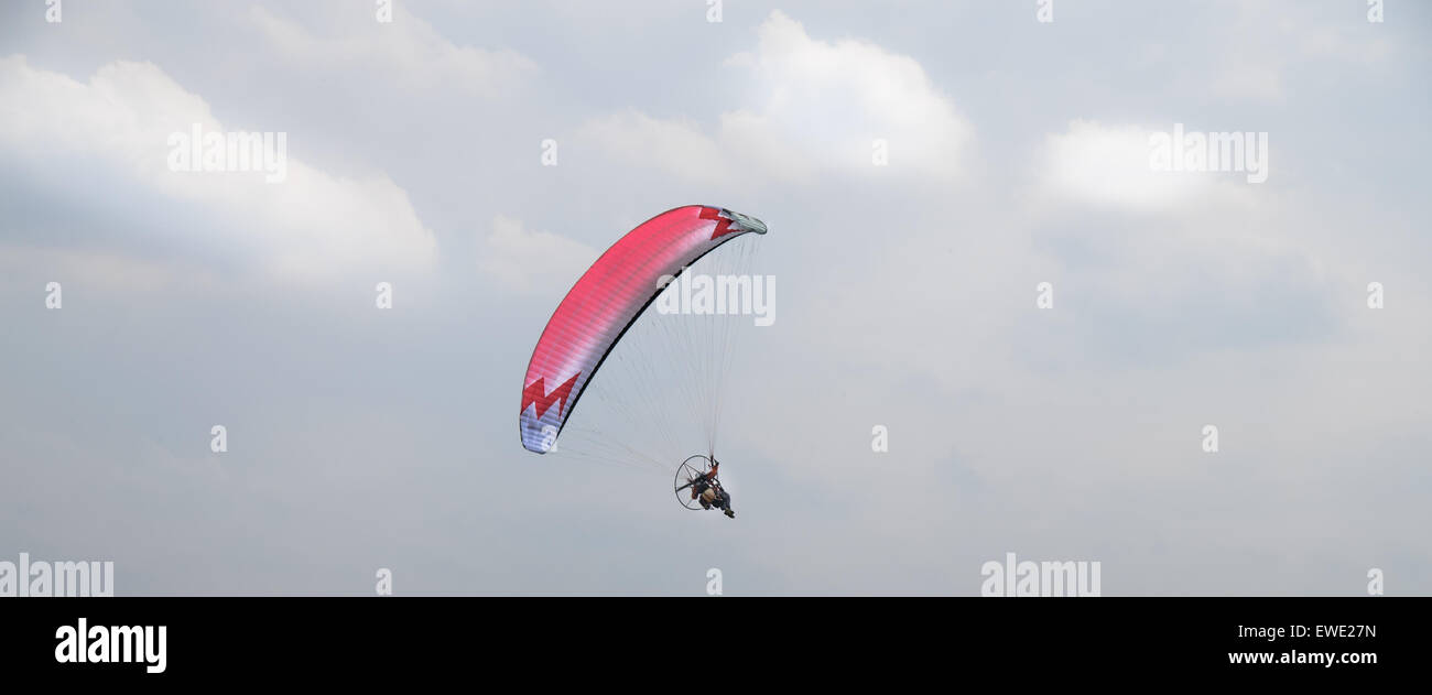 motorized paraglider flying in the blue sky Stock Photo - Alamy