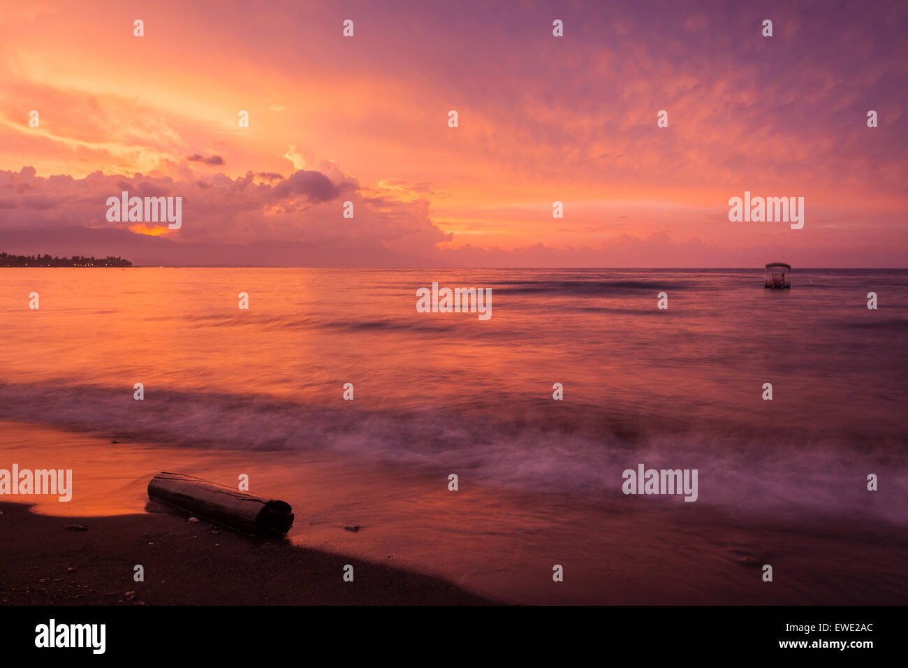 Vibrant tropical sunset at Bali indonesia Stock Photo - Alamy